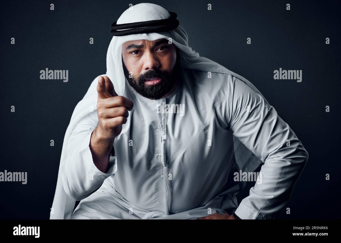 Make the most with what you have. Studio shot of a young man dressed in ...
