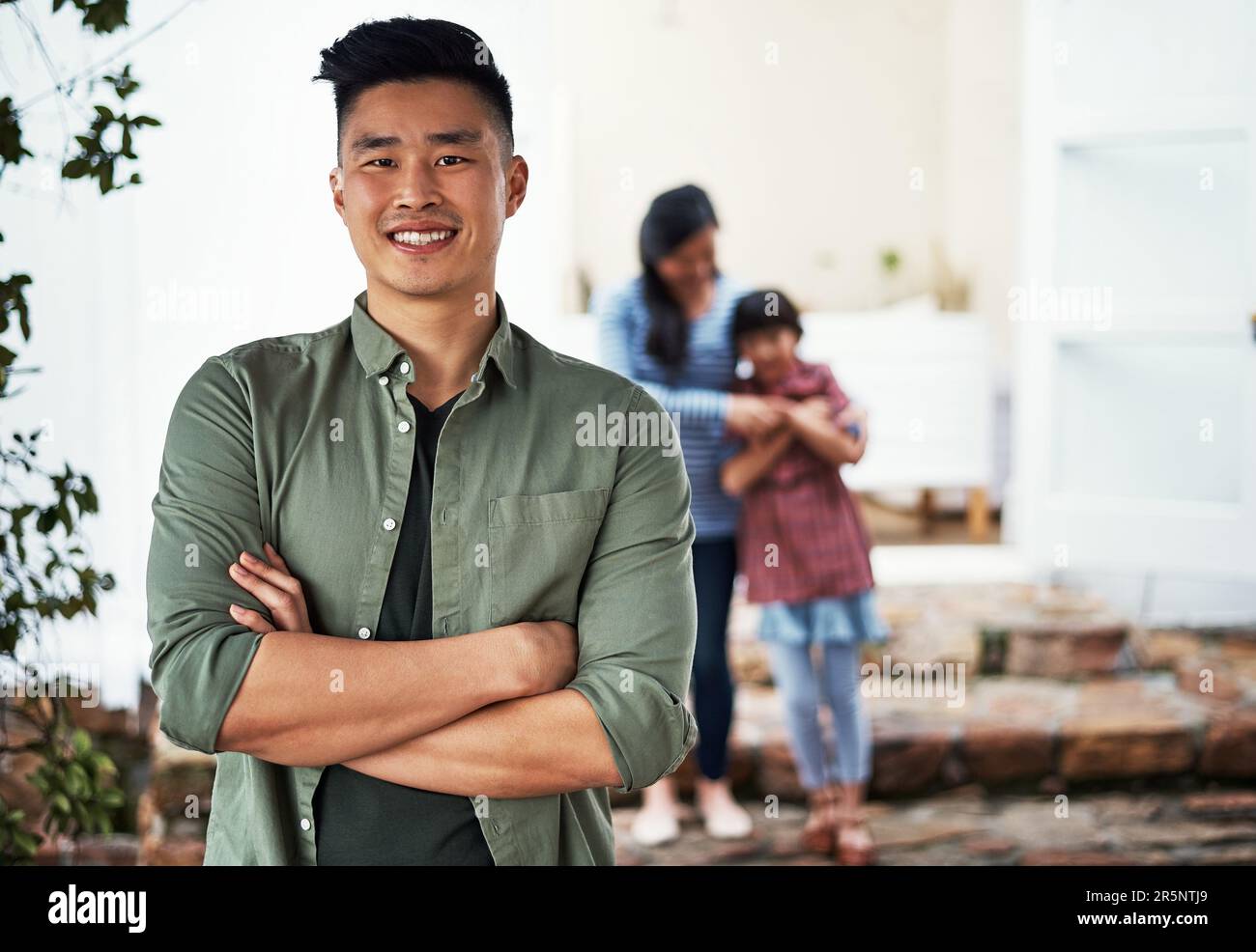 Family always comes first for me. Portrait of a young man relaxing with ...