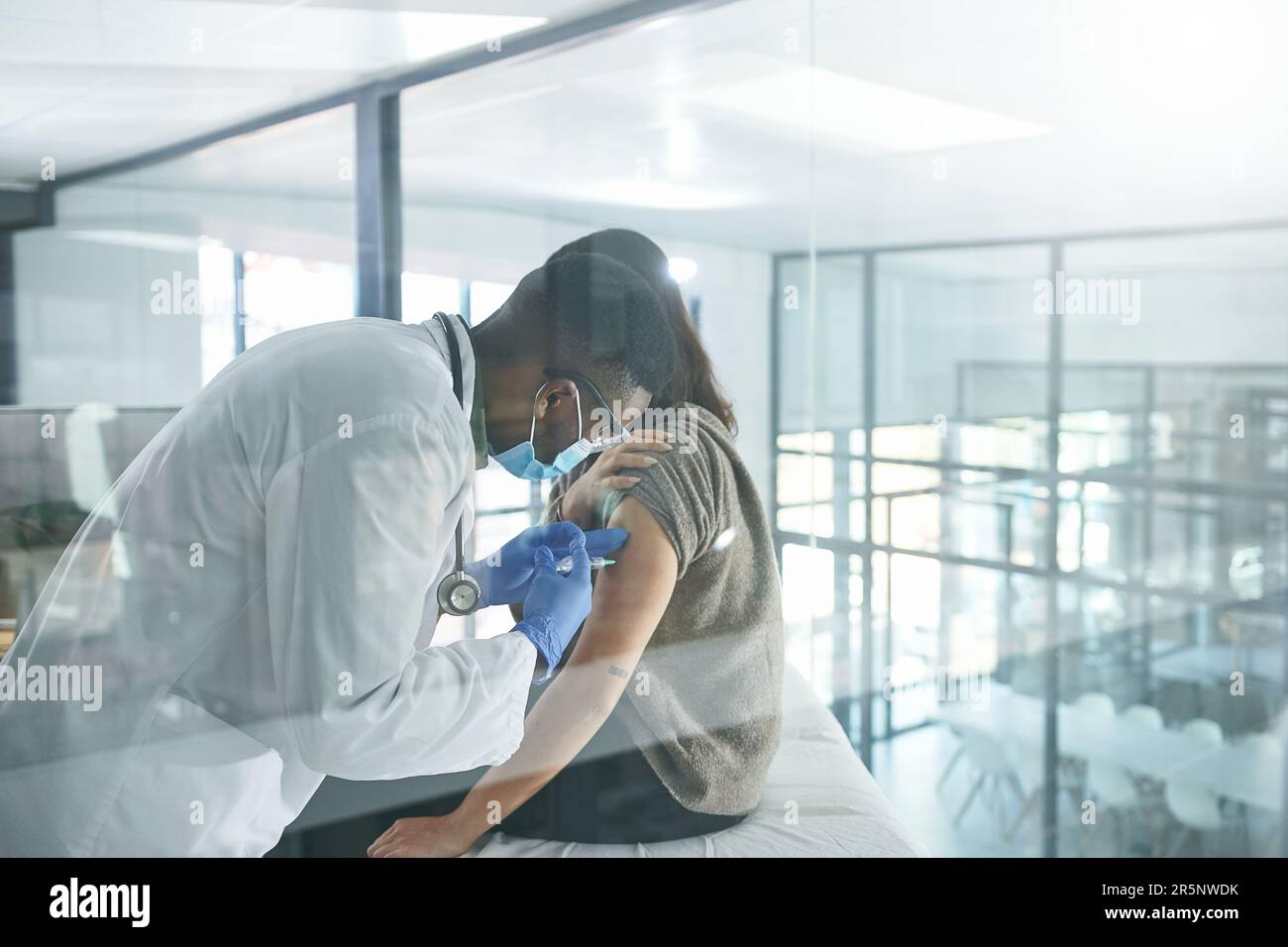 It wont even sting. an unrecognizable doctor giving a patient an ...