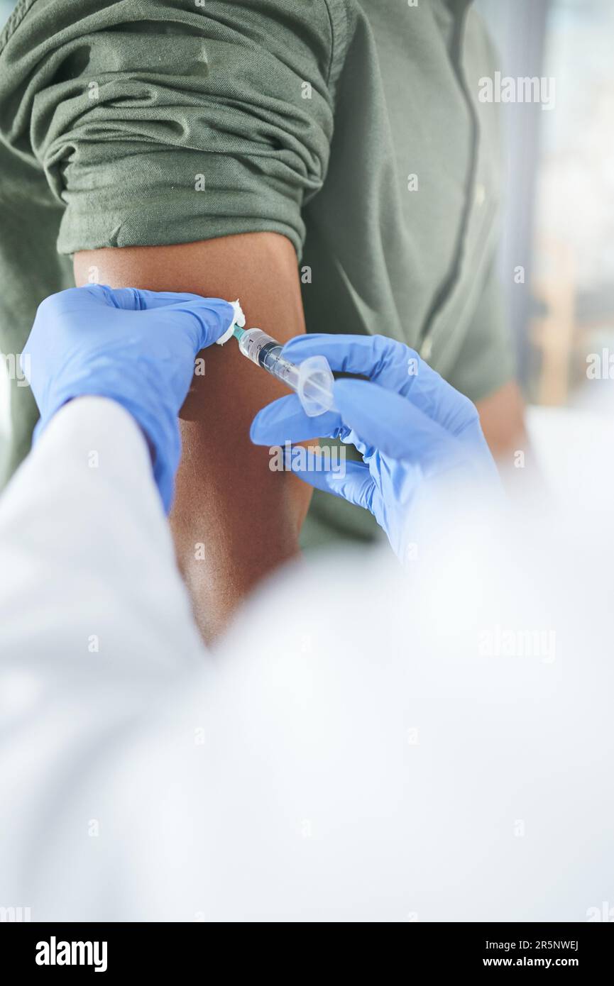 Stay safe, stay vaccinated. an unrecognizable doctor giving a patient ...