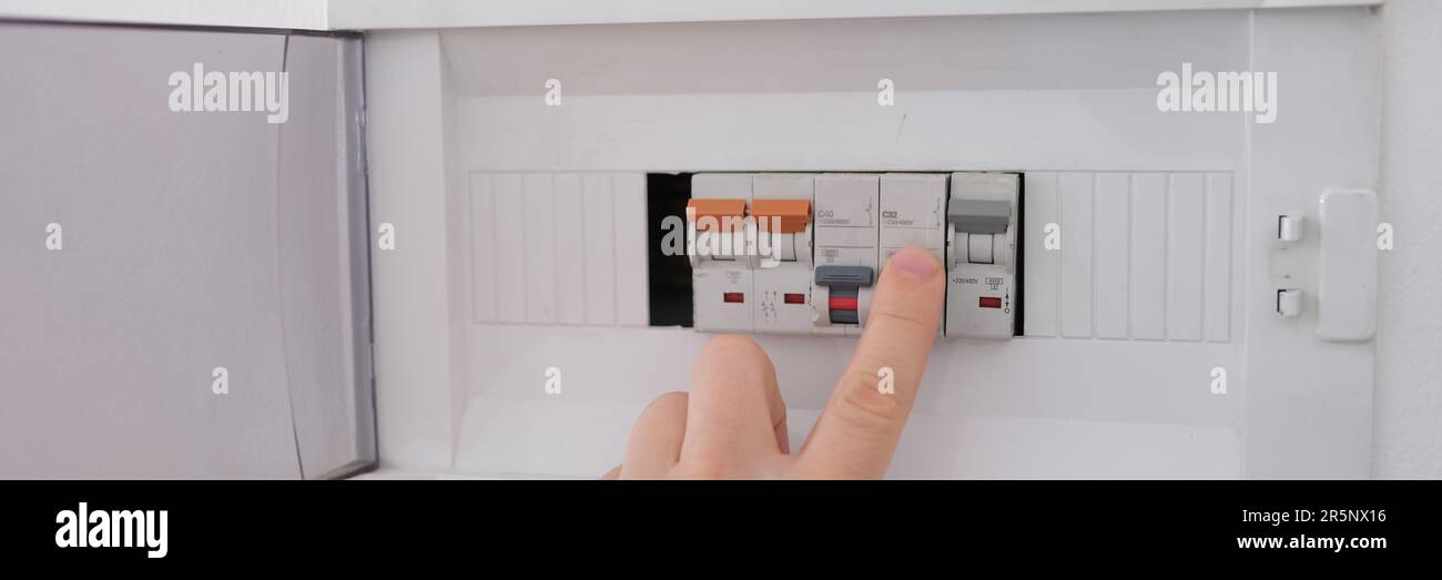 Turning on circuit breaker on control panel after it tripped due to ...