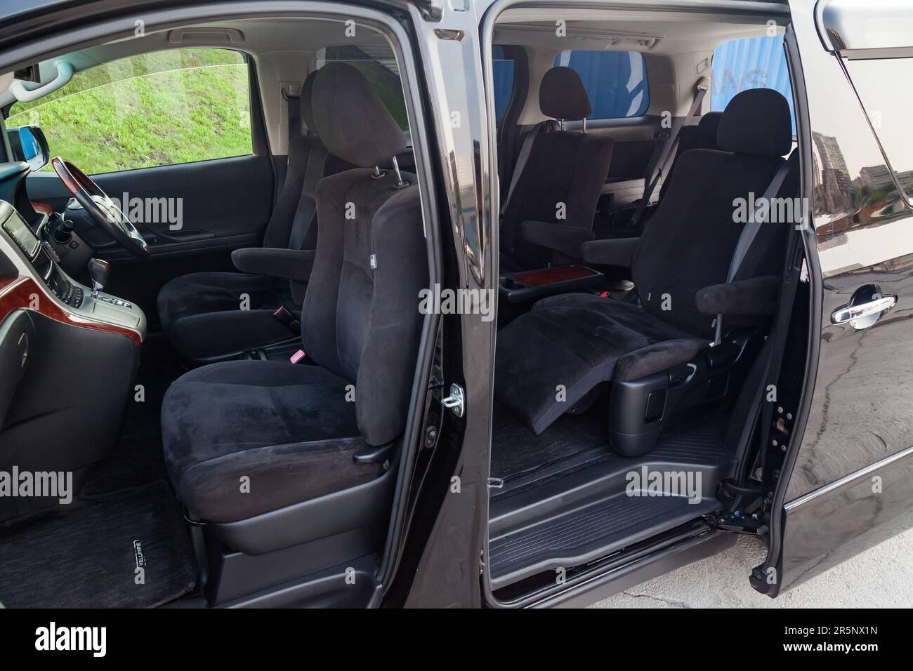 japanese luxury minivan car interior view through the opened doors with ...