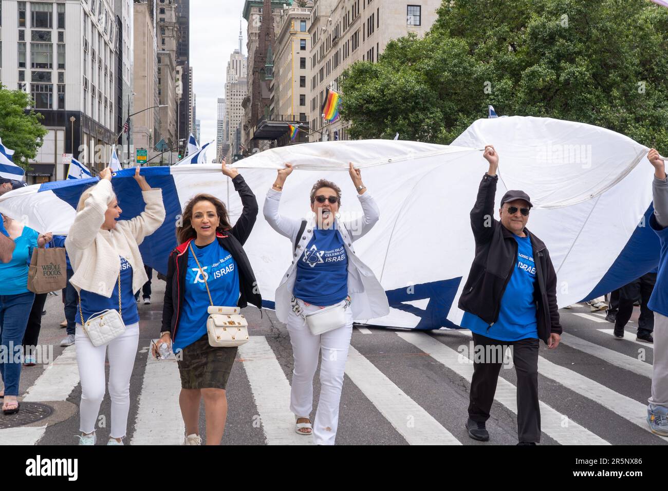 NEW YORK, NEW YORK - JUNE 04: Participants holding a giant Israeli flag ...