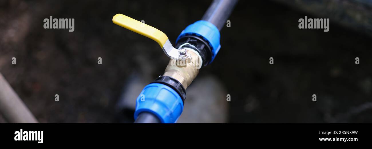 Pvc pipes with tap in ground on garden plot closeup Stock Photo - Alamy