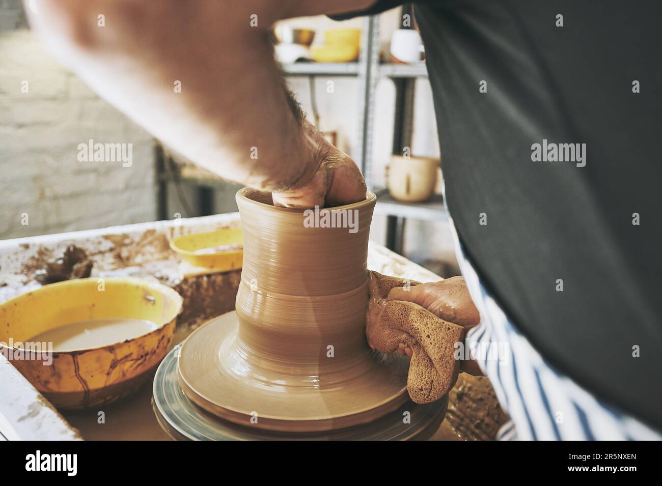 Its messy work but its worth it. an unrecognisable man working with ...