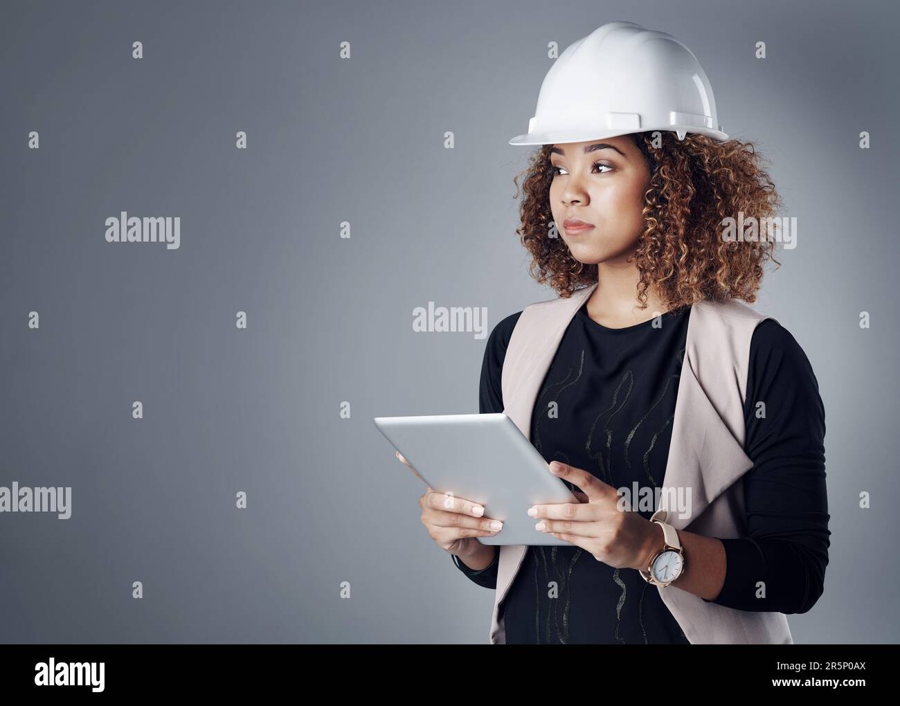 Constructing cities in her mind. a well-dressed civil engineer using ...