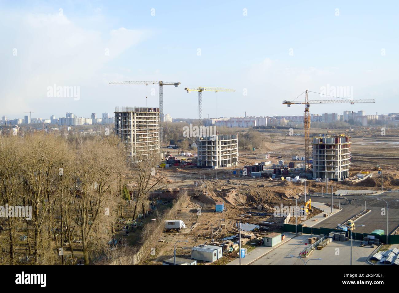 Top view of a large construction site with cranes and buildings houses ...