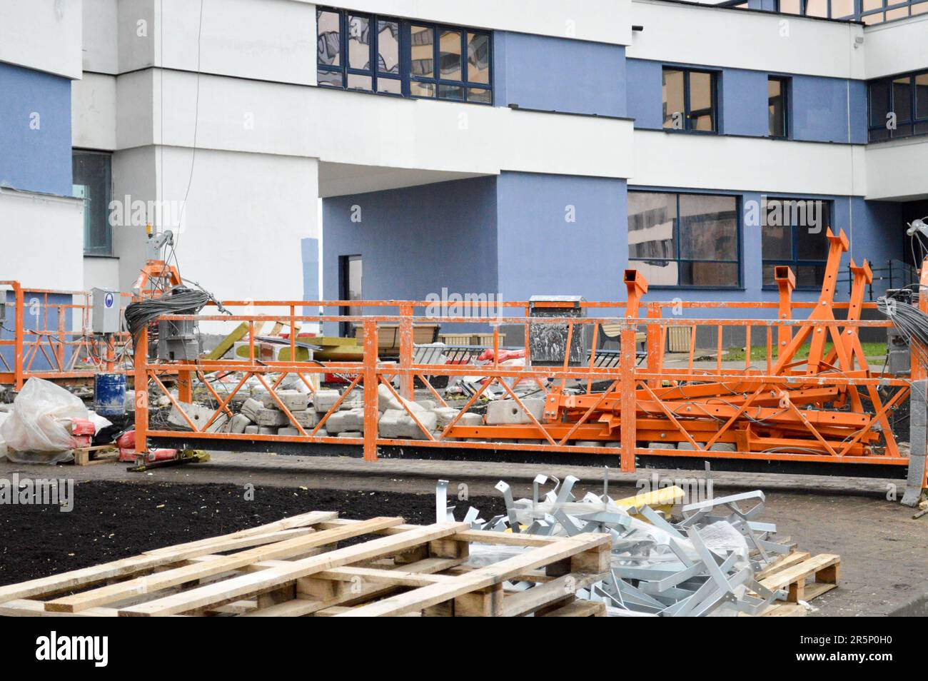 Large iron metal building facade elevator cradle for lifting workers ...
