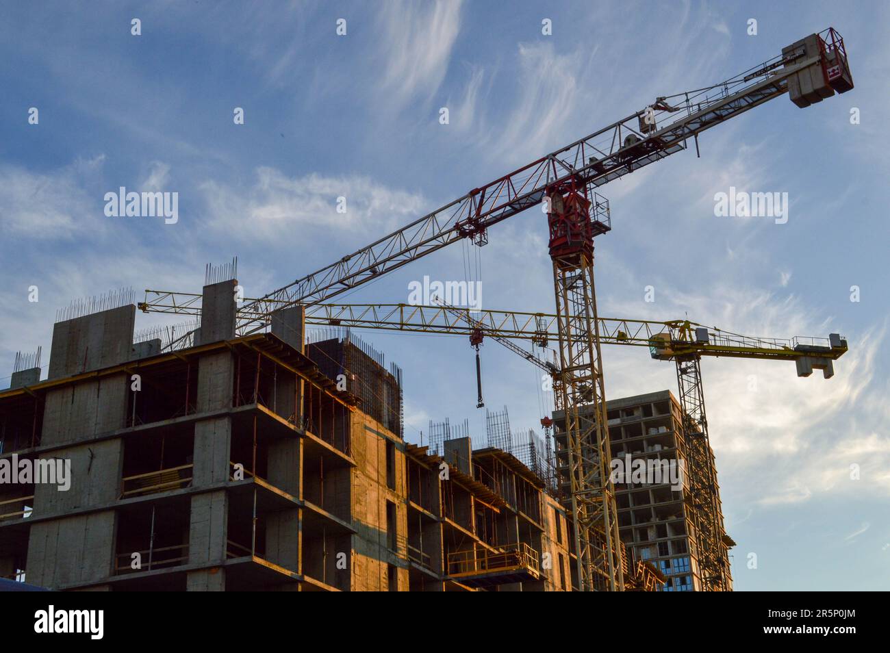 construction of a new residential concrete house. cranes are folding ...