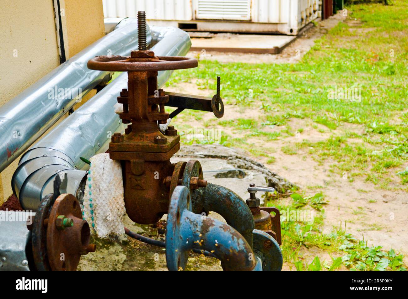 Iron old rusty corrosion-proof industrial metal pipes with flanges ...