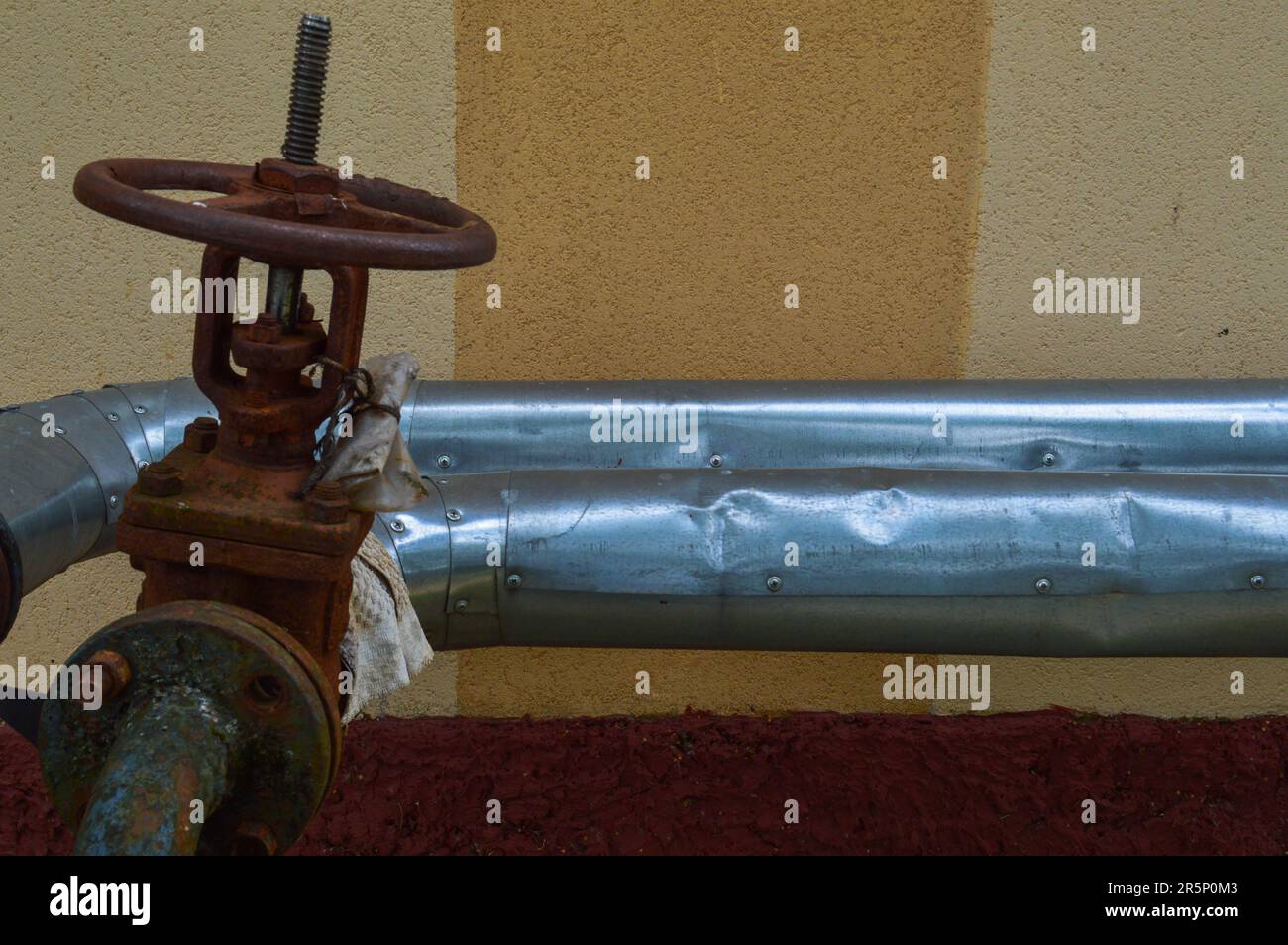 Iron old rusty corrosion-proof industrial metal pipes with flanges ...