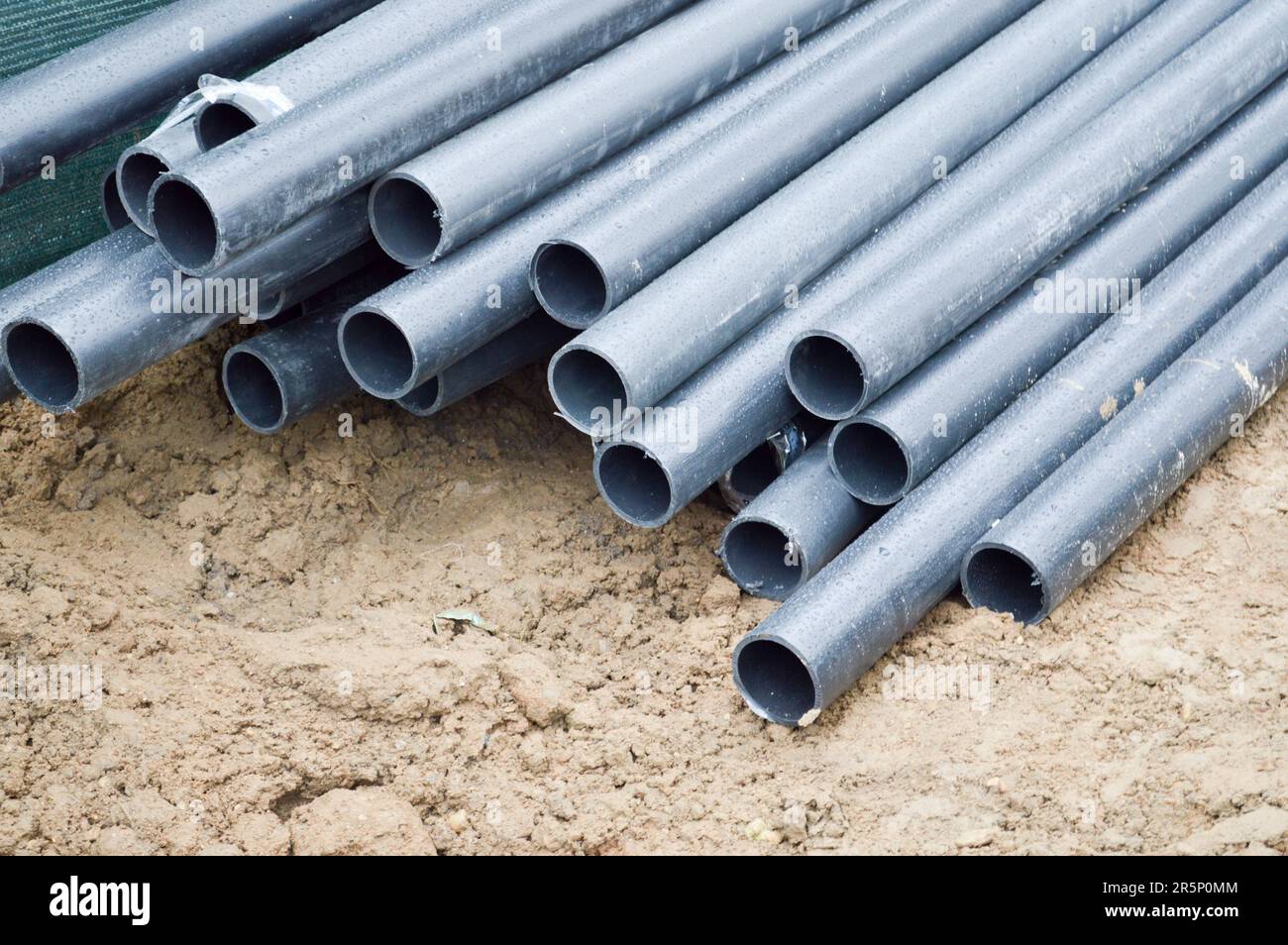 Large black plastic sewer plumbing pipes for the construction of water ...