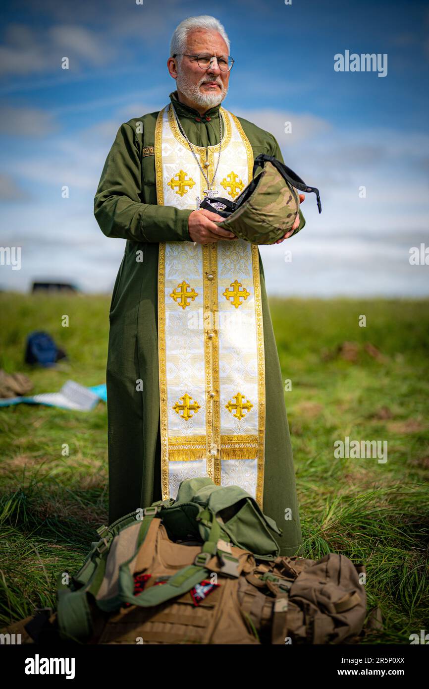Ukrainian military chaplain 2nd Lieutenant Genadij Rohmanijko, holds a ...
