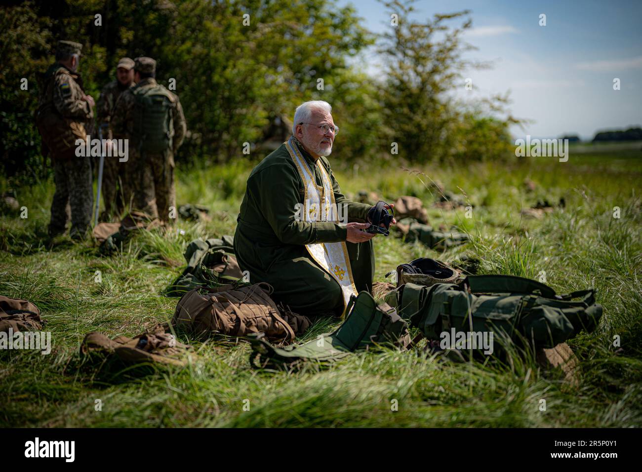 Ukrainian military chaplain 2nd Lieutenant Genadij Rohmanijko, inspects ...