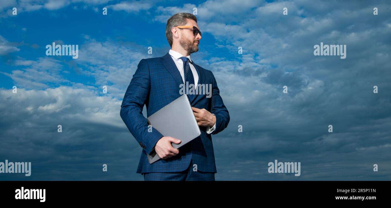 Successful IT director holding laptop. Professional man director ...