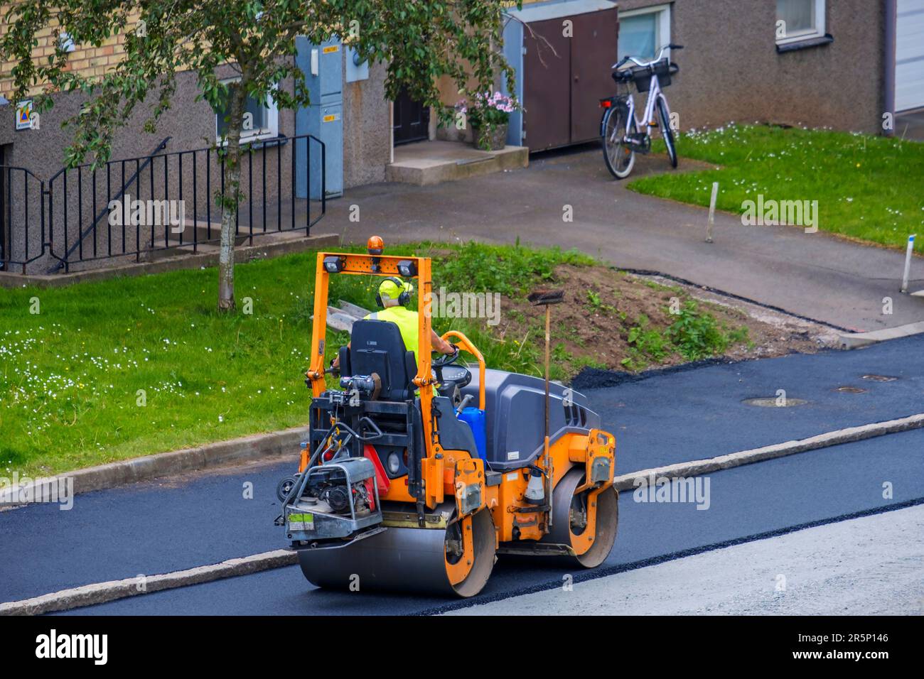 Road roller on a city street Stock Photo - Alamy