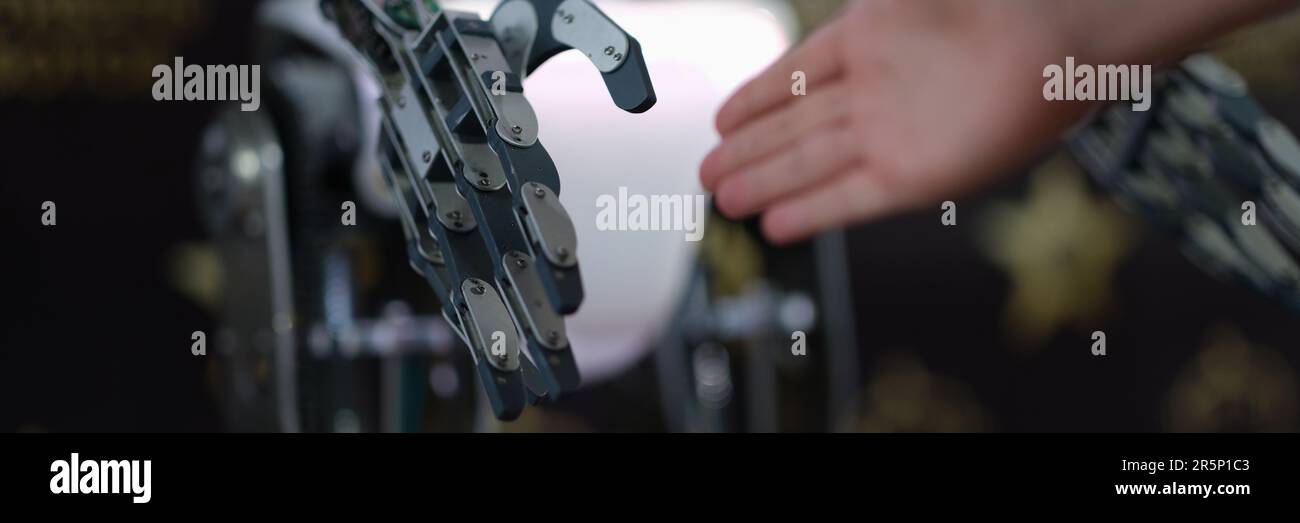 Businessman hand shaking hands with robot droid. Concept of human ...