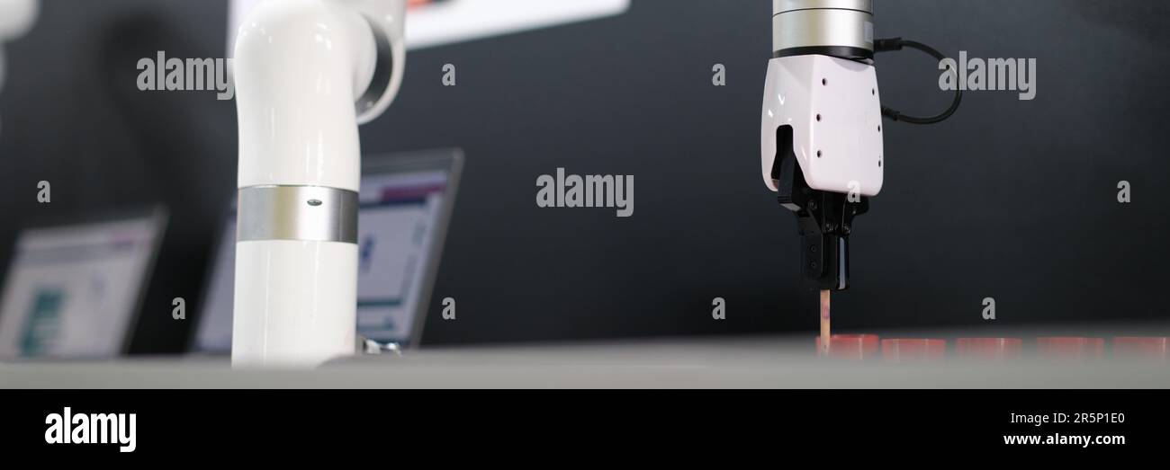 Robotic arm and mechanical hand manipulator closeup Stock Photo - Alamy