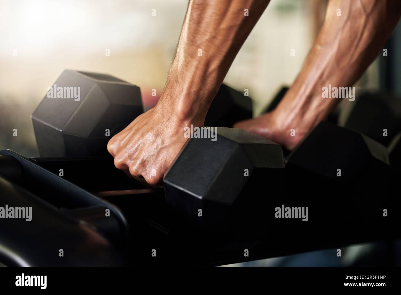 Hands, training and man exercise with weights in a gym for strength ...