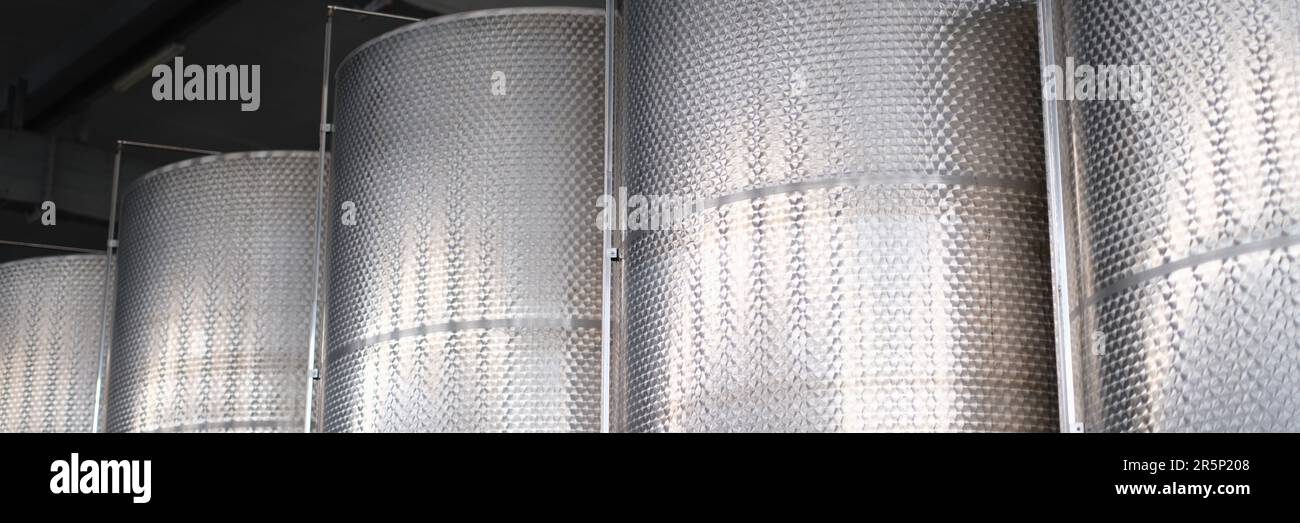 Steel tanks for storing alcohol in winery closeup Stock Photo - Alamy