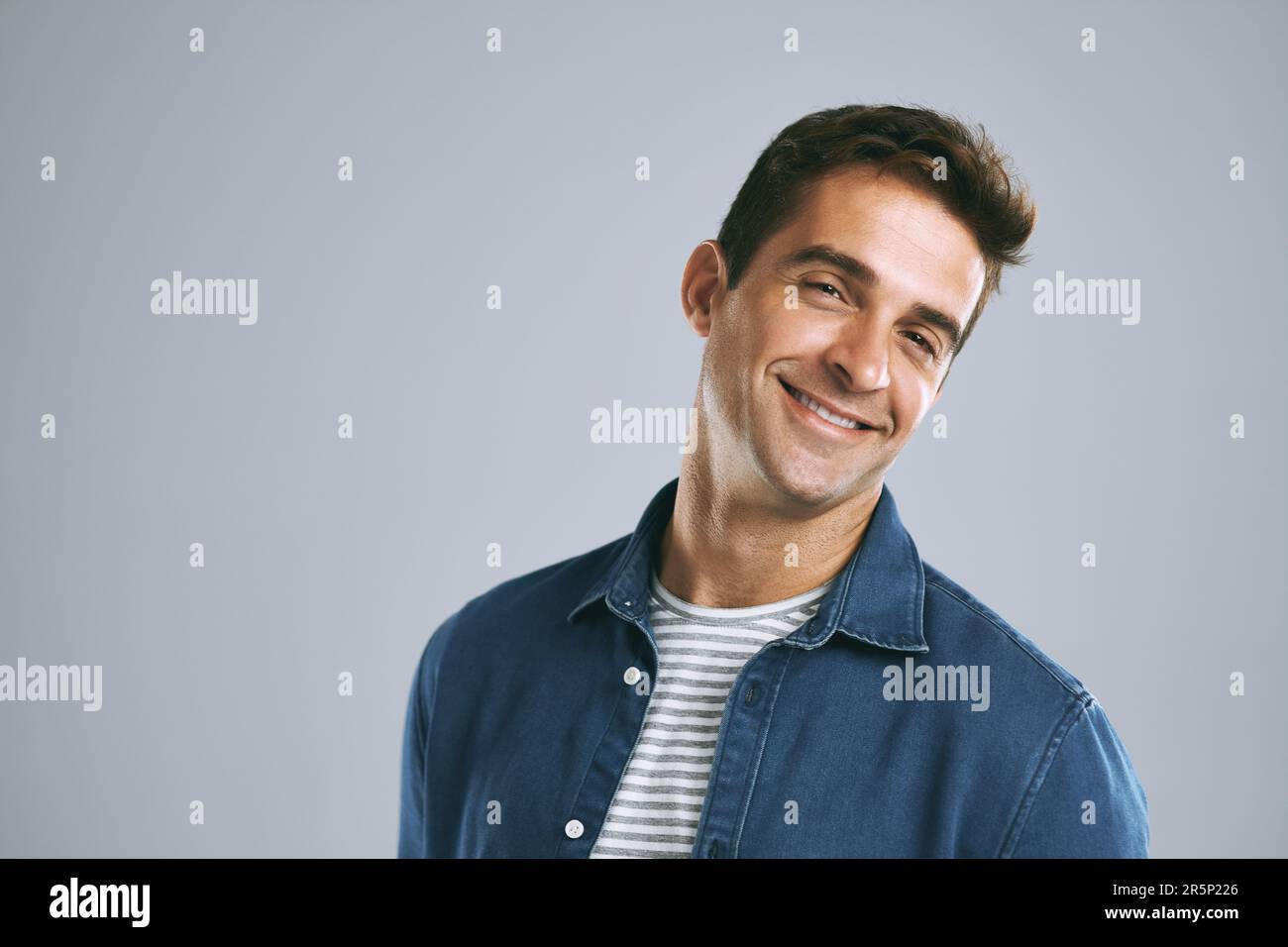 Positivity is what gets us through life. a handsome man posing against ...