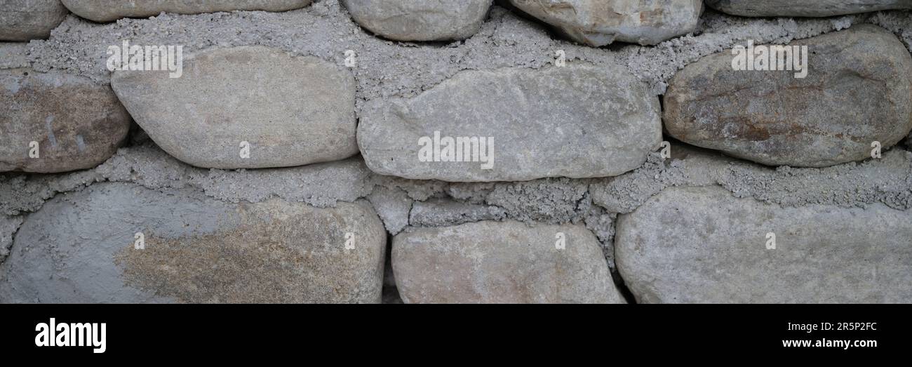 Neatly stacked rough cut stone wall seamless texture background Stock ...