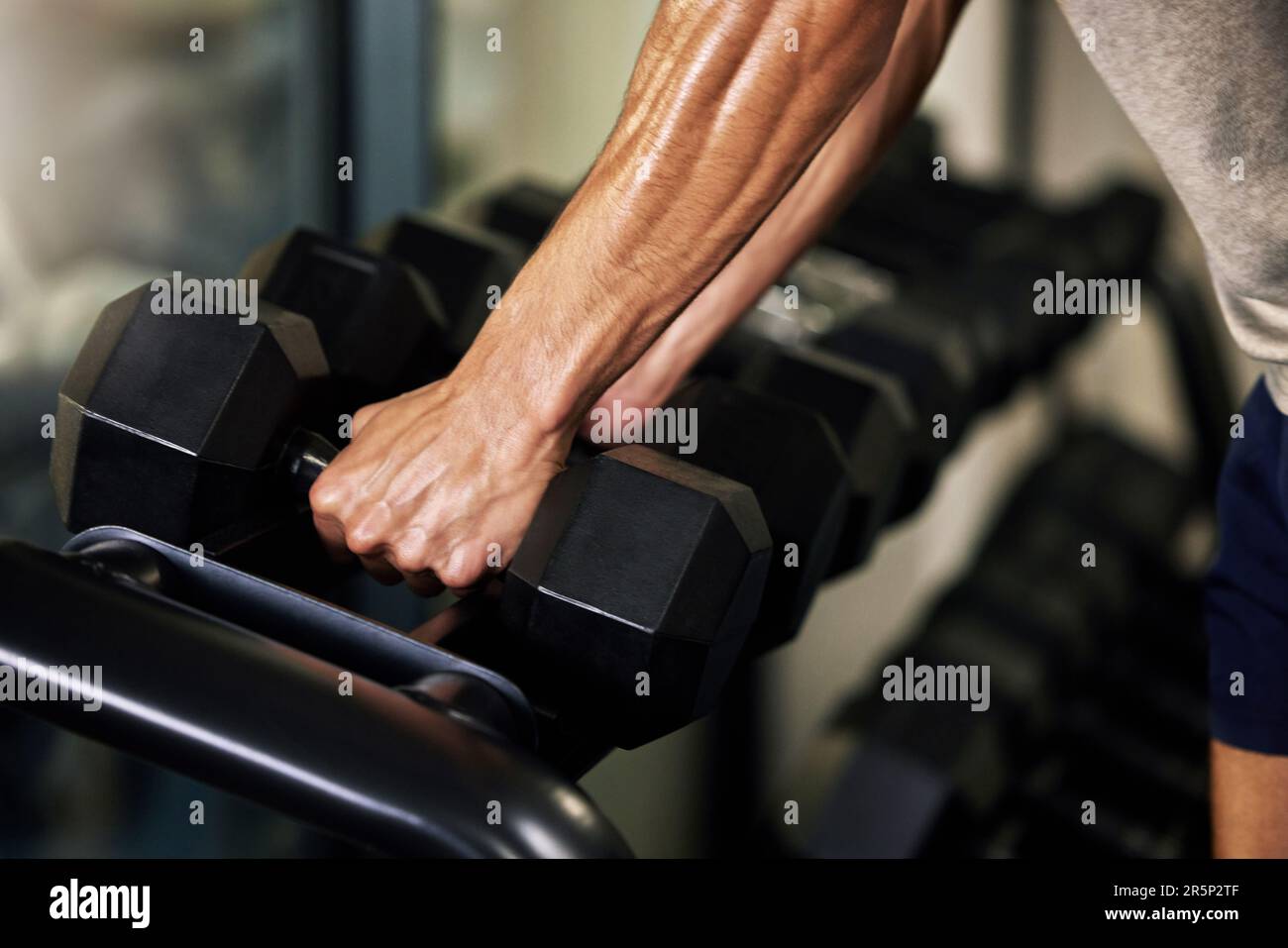 Hands, fitness and man doing weight training in a gym for strength ...