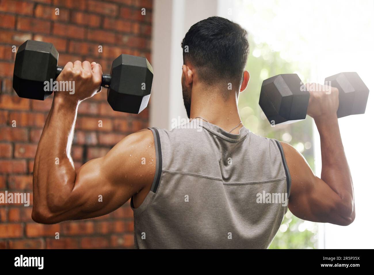 Weightlifting, muscle and man with dumbbell in gym for exercise ...