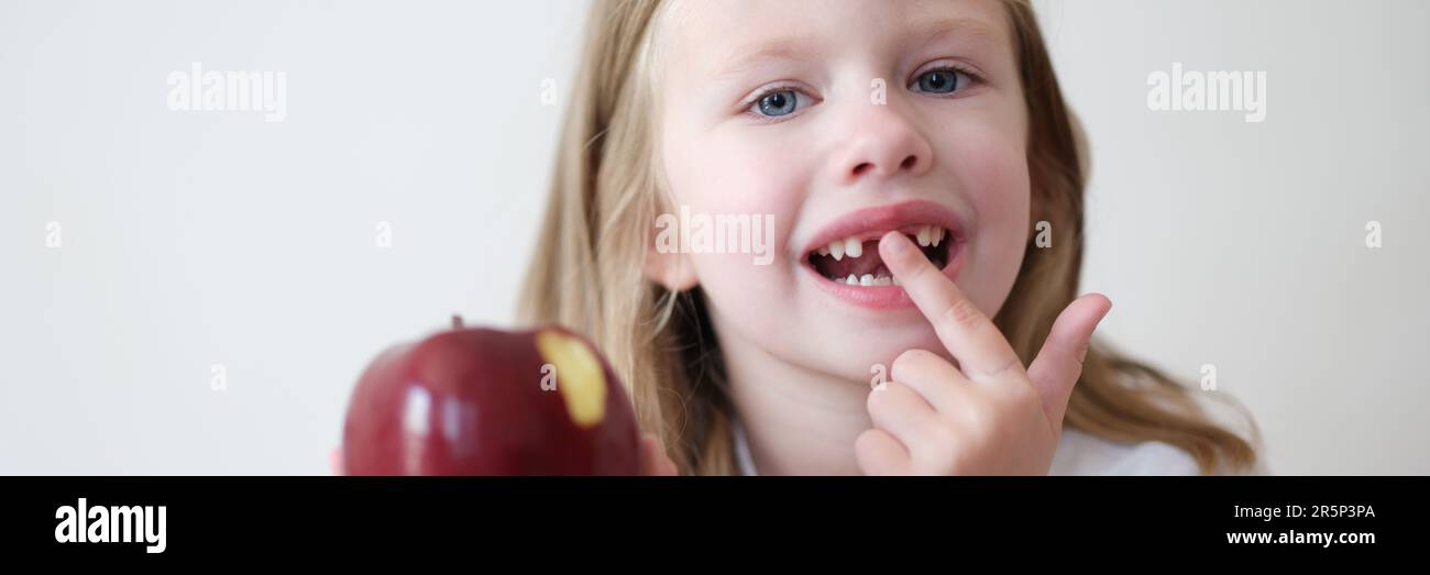 Portrait of a beautiful little girl without teeth with apple Stock ...