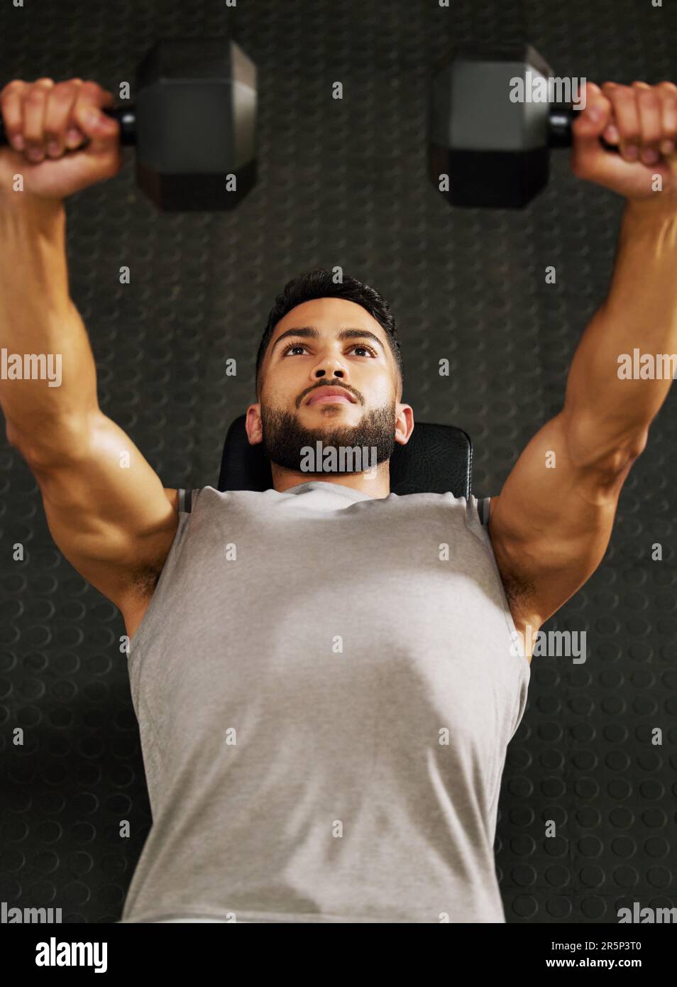 Bench press, fitness and man with weights in gym for exercise ...