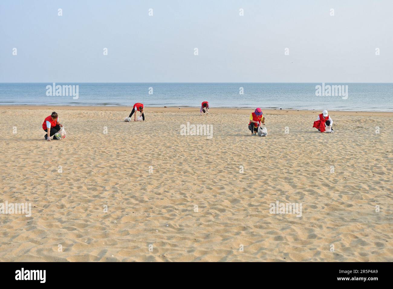 YANTAI, CHINA - JUNE 5, 2023 - Volunteers pick up garbages at the ...