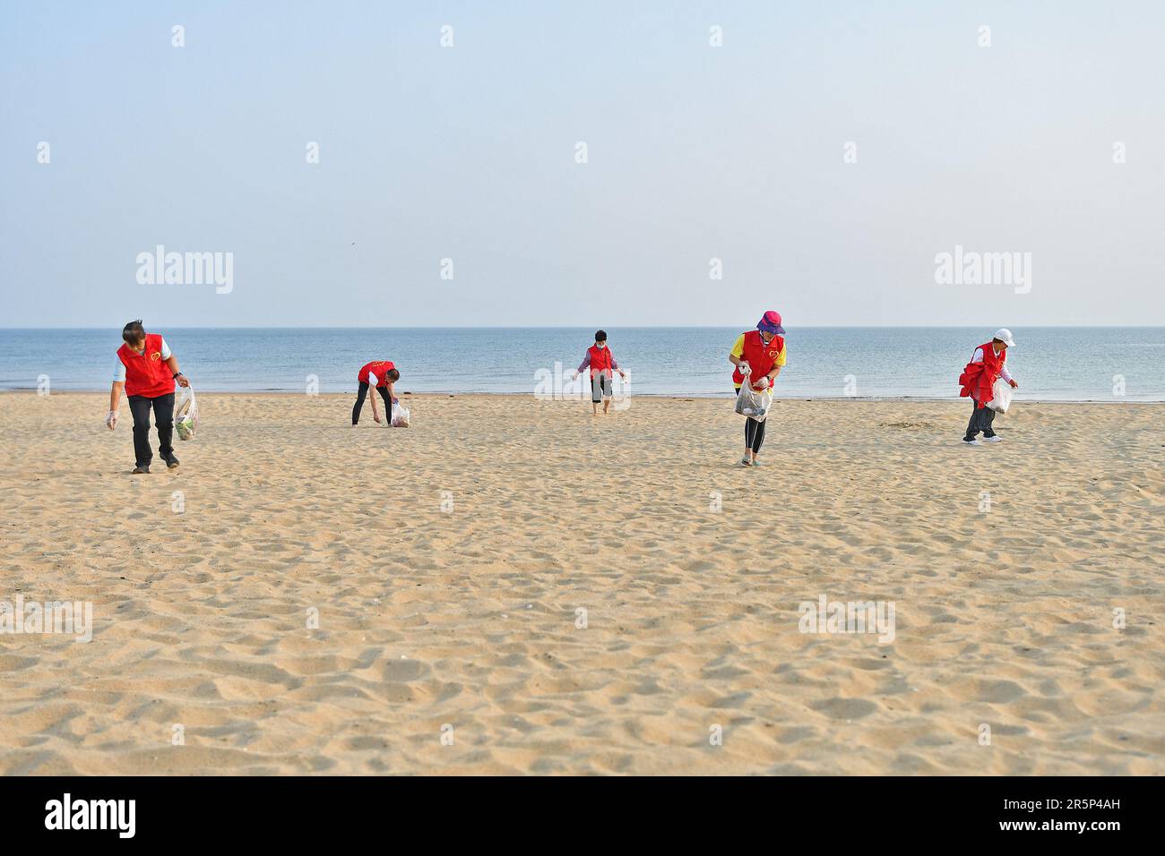 YANTAI, CHINA - JUNE 5, 2023 - Volunteers pick up garbages at the ...