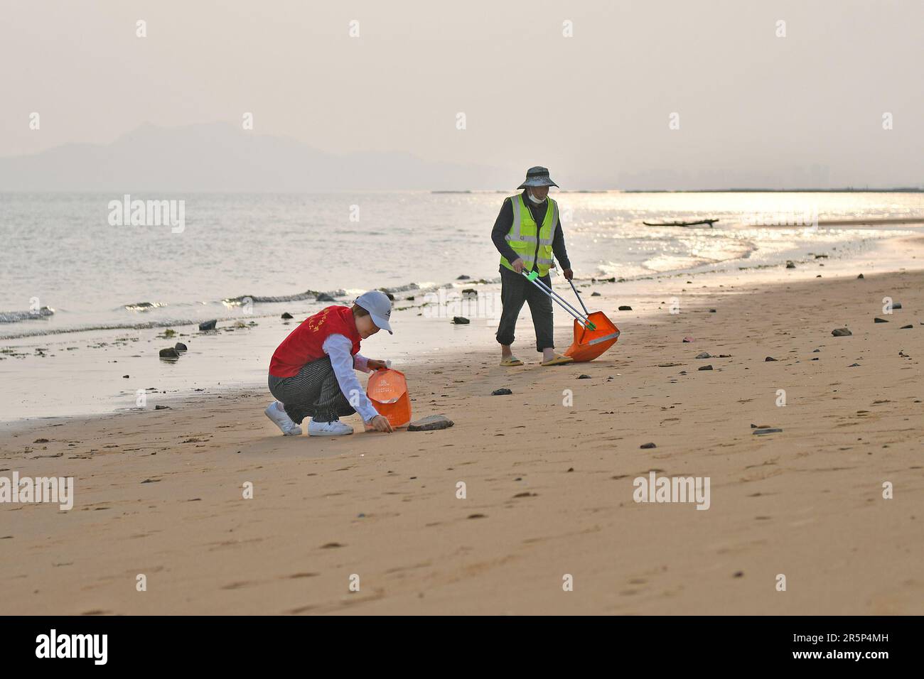 YANTAI, CHINA - JUNE 5, 2023 - Volunteers pick up garbages at the ...