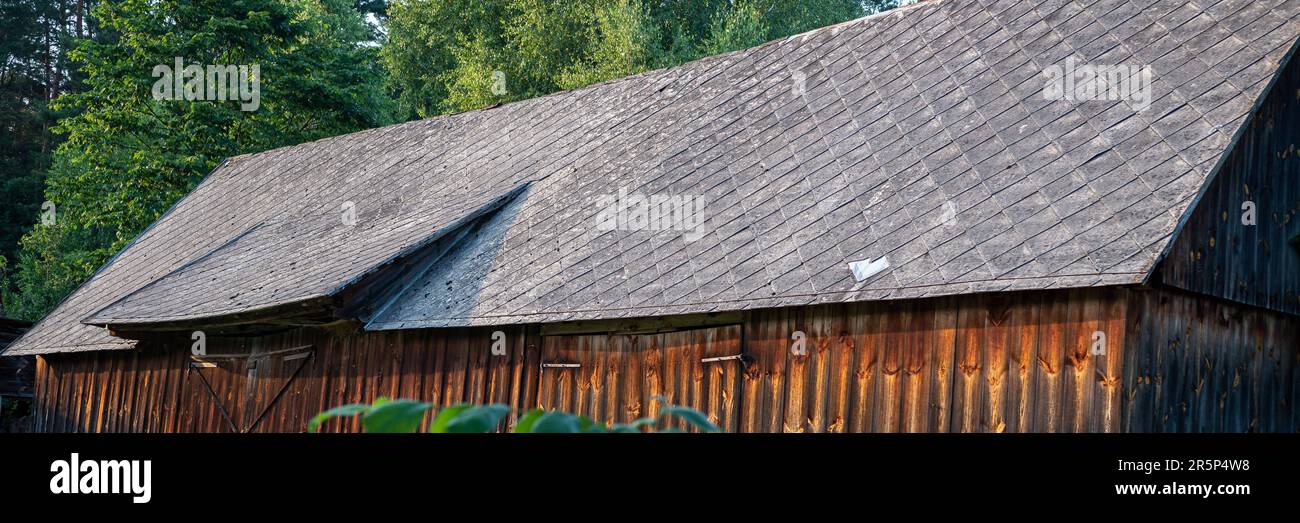 An old barn made of dark aged boards Stock Photo - Alamy