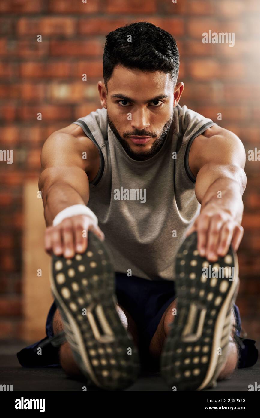 Gym, feet and portrait of man stretching, workout warm up and ...
