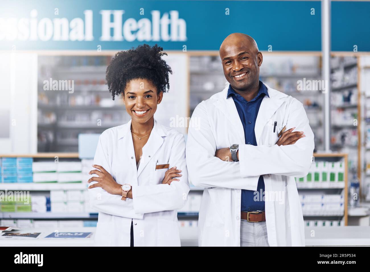 We work together for our communitys health. Portrait of two pharmacist ...