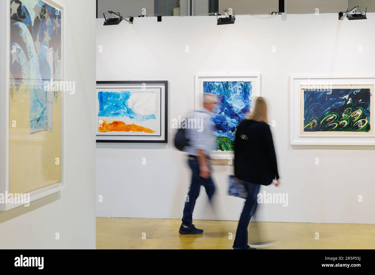 People Walking and Admiring Paintings in a Modern Art Gallery Stock ...