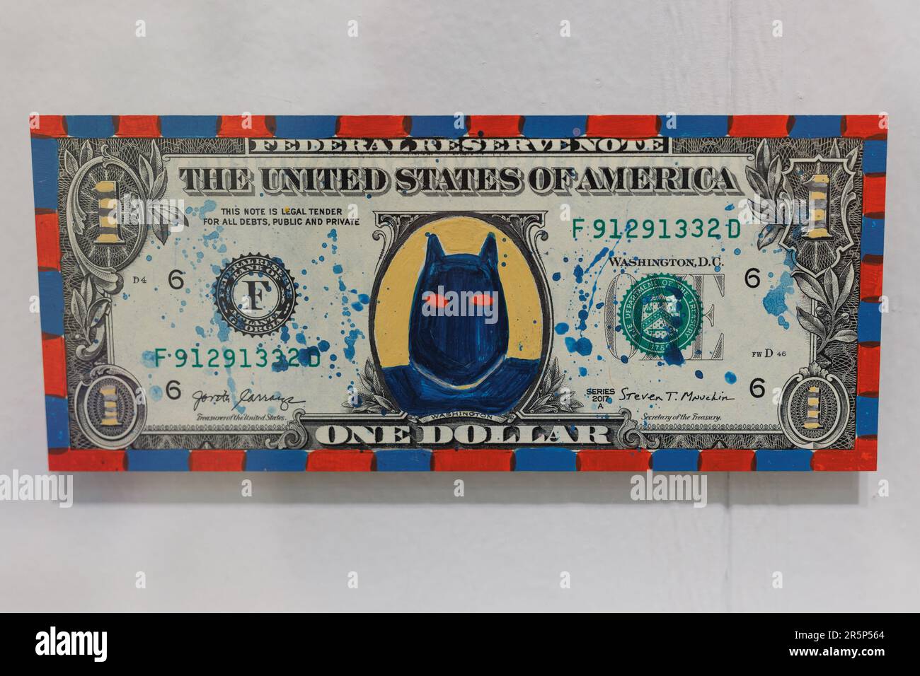 One Dollar Banknote stained with Blue Ink and with a Masked Hero Drawn ...
