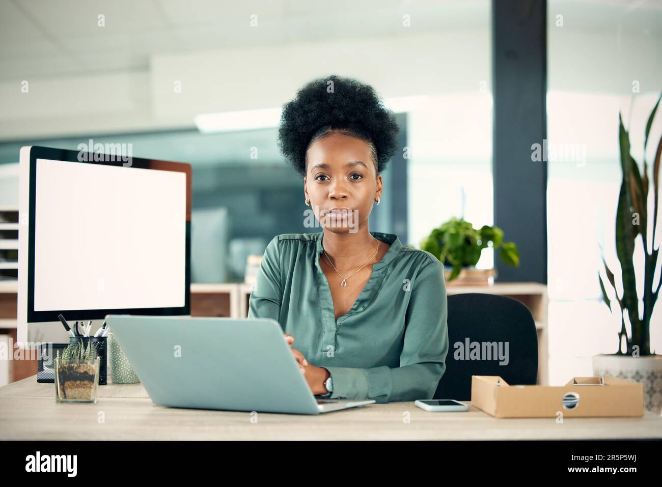Portrait, serious and black woman with laptop, writer and creative in ...