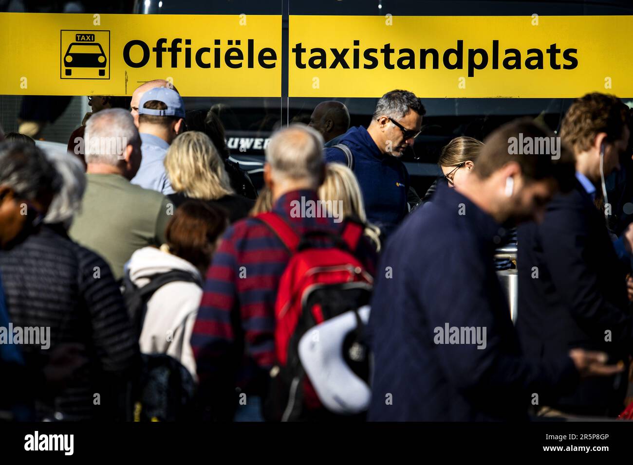SCHIPHOL - Stranded travelers at Schiphol Airport wait at the official ...
