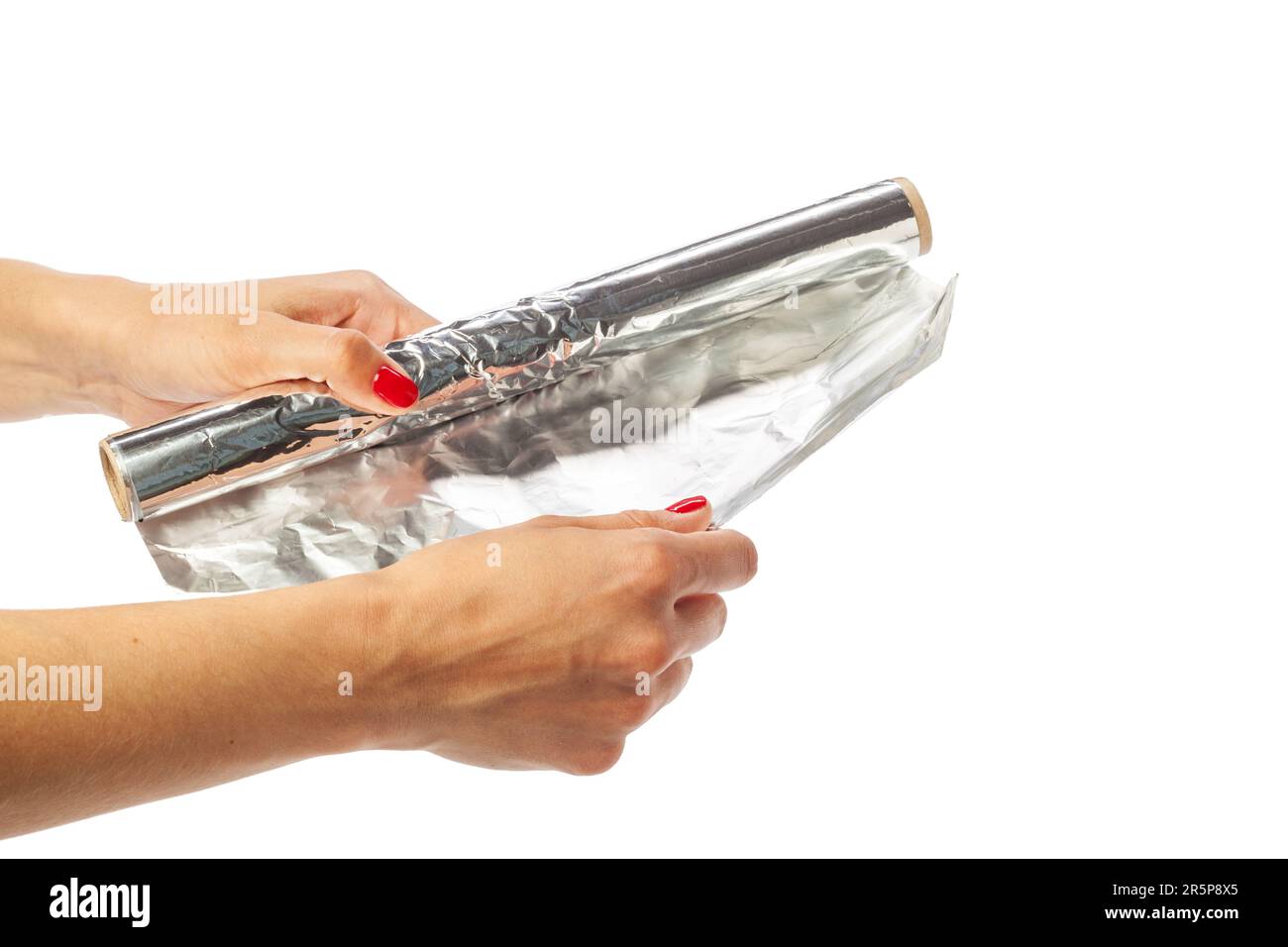 human hand holding a roll of foil on a white background Stock Photo - Alamy