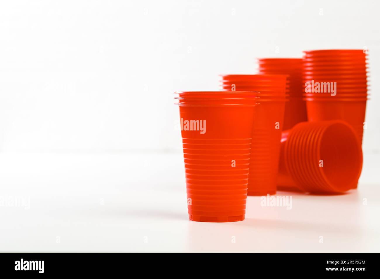 red disposable plastic glasses Stock Photo - Alamy