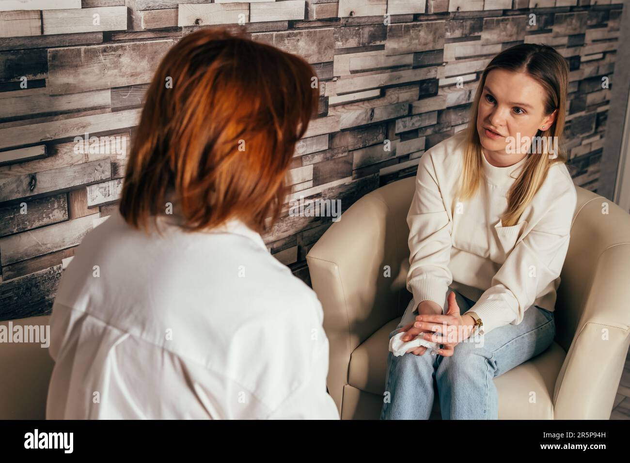 Therapist talk to his patient. Woman psychologist talking to patient ...