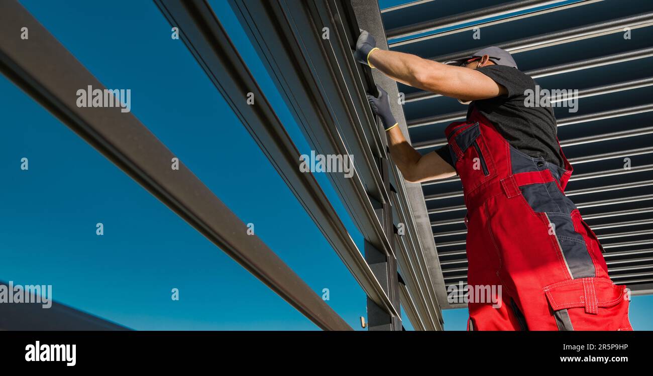 Professional Worker in His 40s Finishing Installation of Dark Modern ...