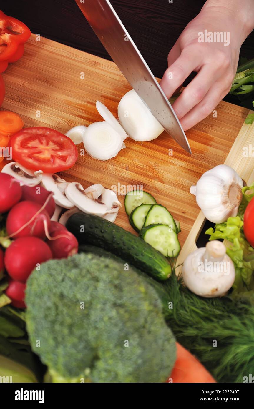 Hand knife cuts pepper hi-res stock photography and images - Alamy
