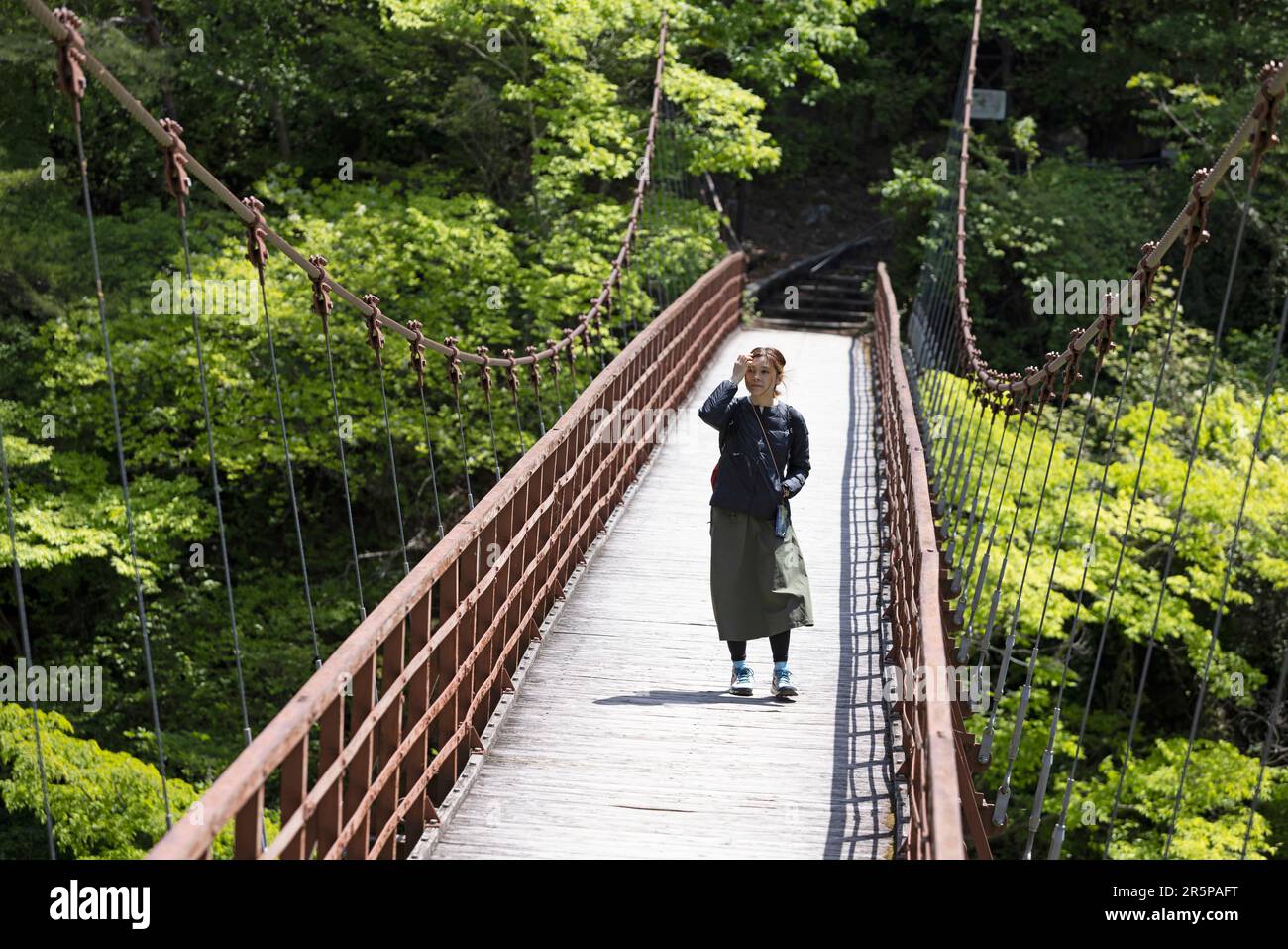 girl walk around on the suspension bridge in kinugawa onsen, tochigi ...