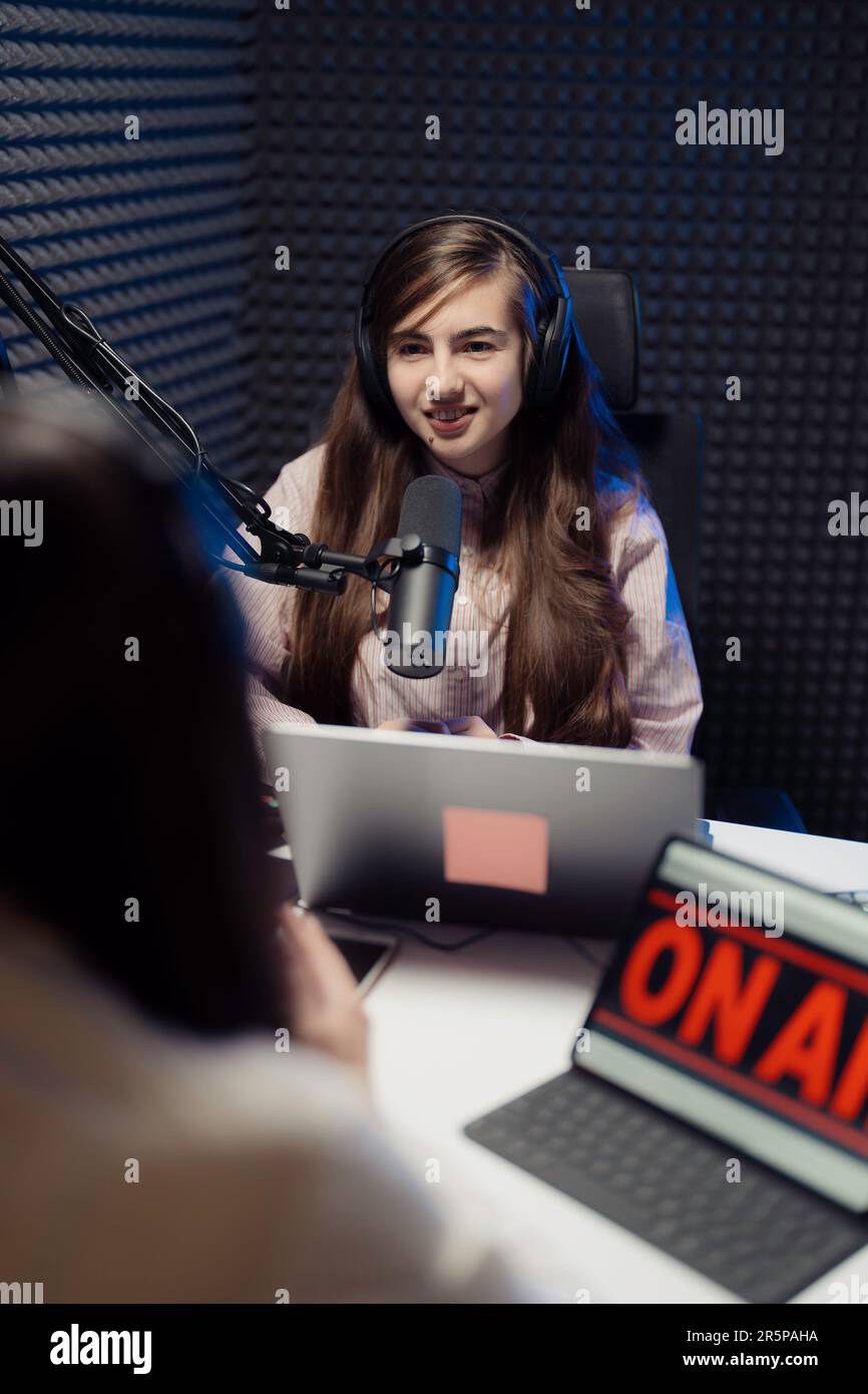 Radio host speaking with guest Stock Photo - Alamy