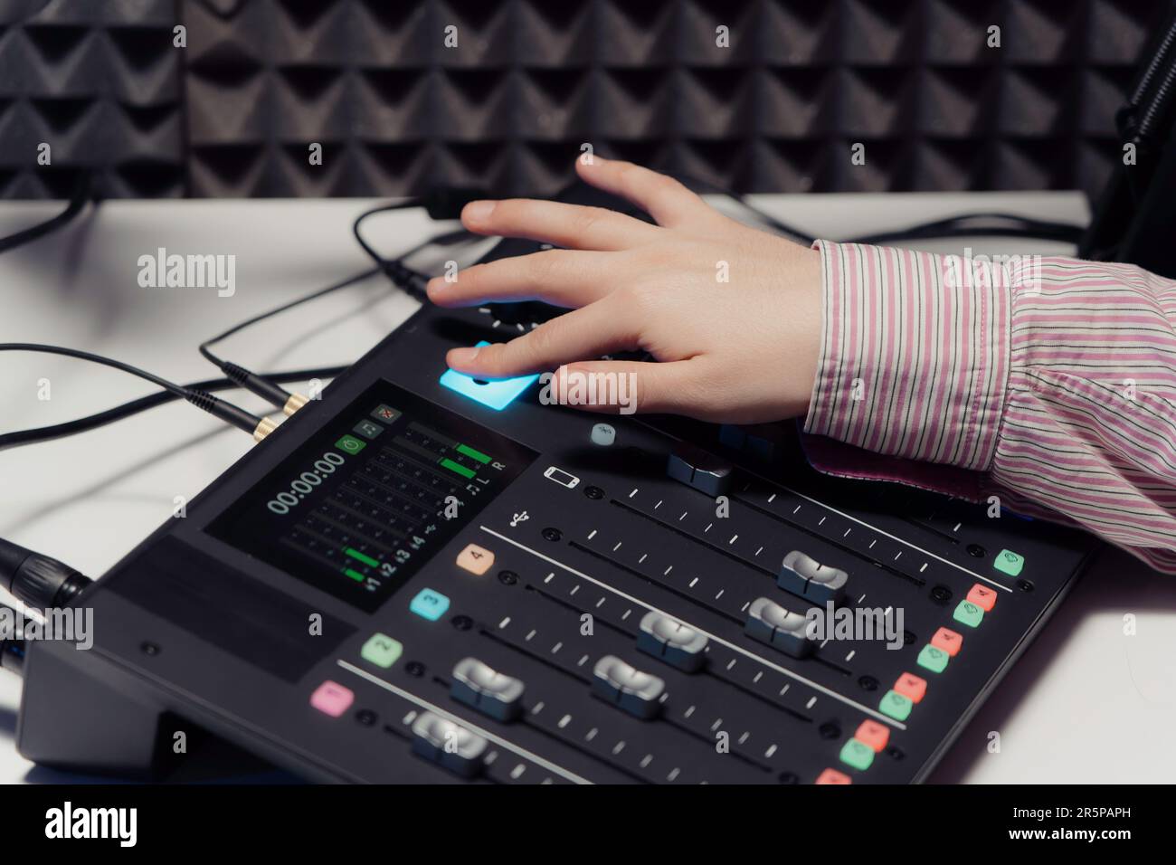 Radio host using mixing console Stock Photo - Alamy