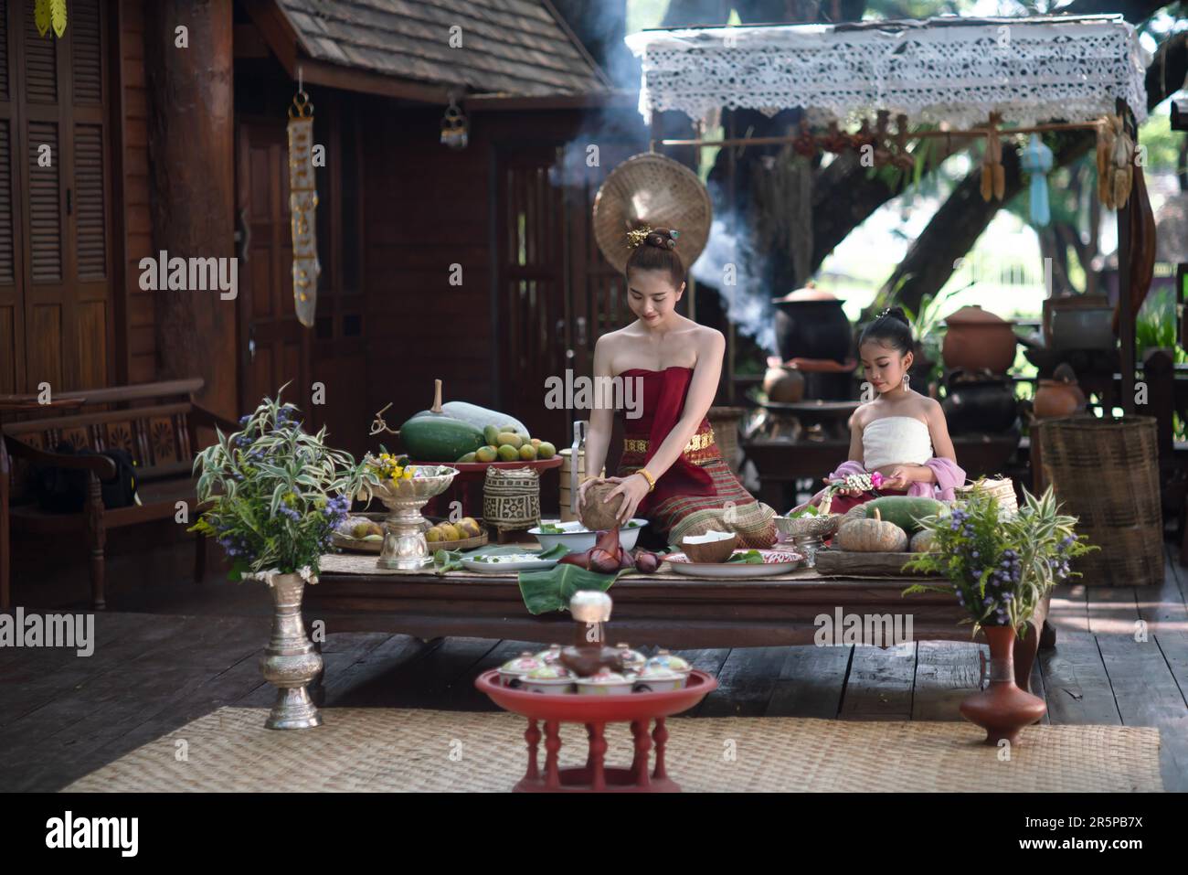 Thai Lanna traditionally dressed women in the Old Lanna house in Chiang ...