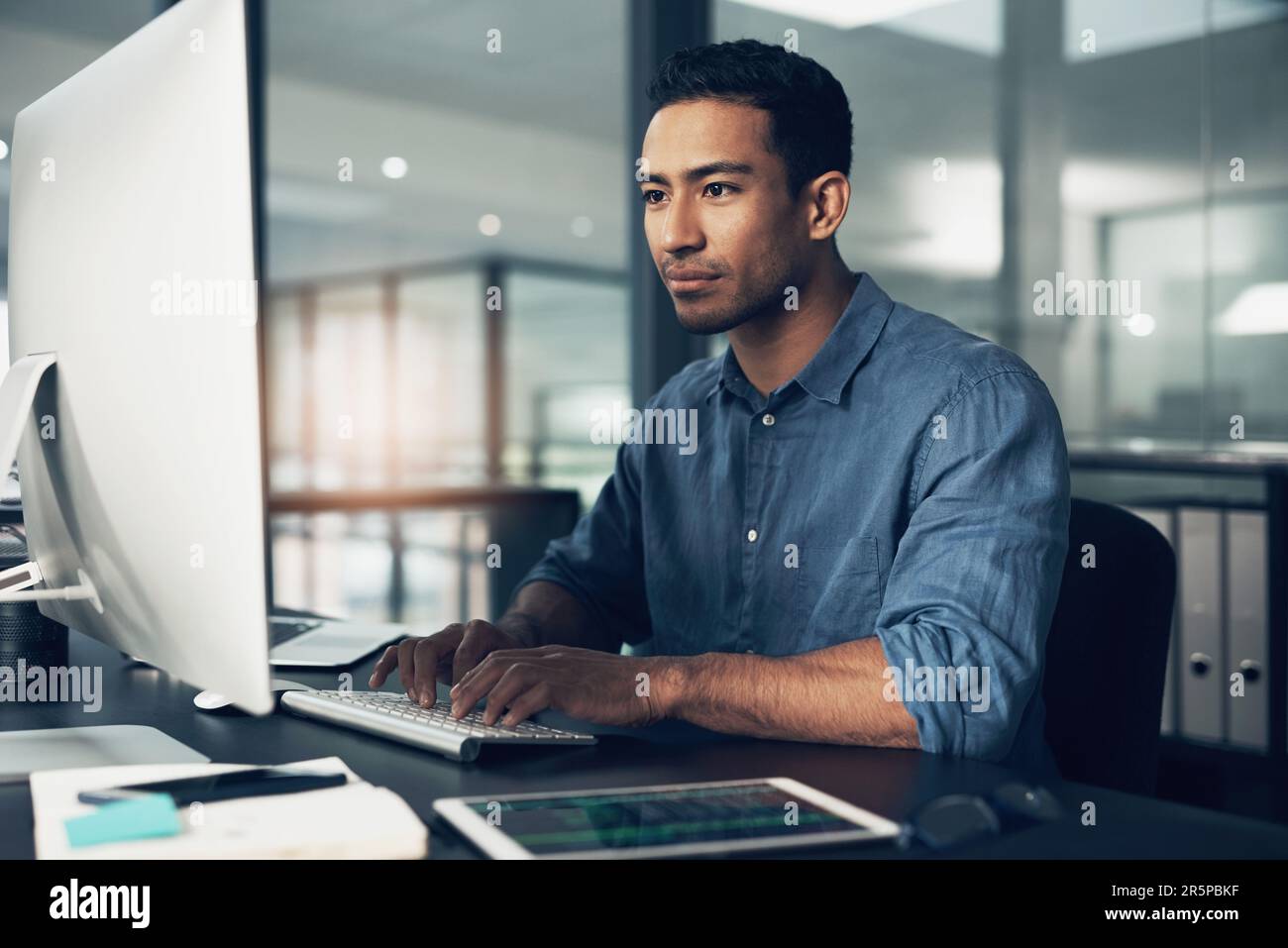 Typing Man And Programmer On Computer In Office At Night For Deadline It Focus And Male Coder